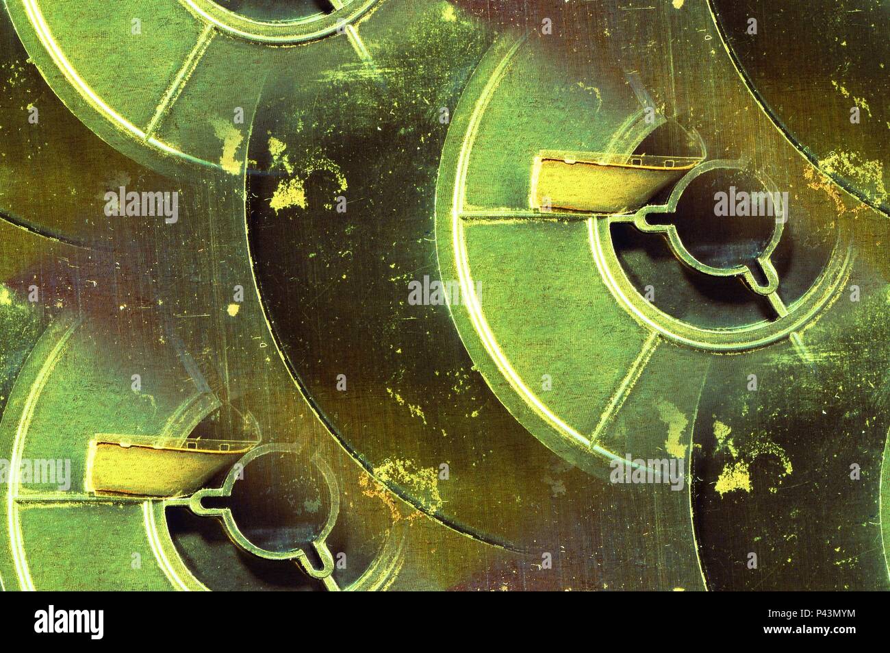 Old film reel on a scratched and rusty metal background Stock Photo - Alamy