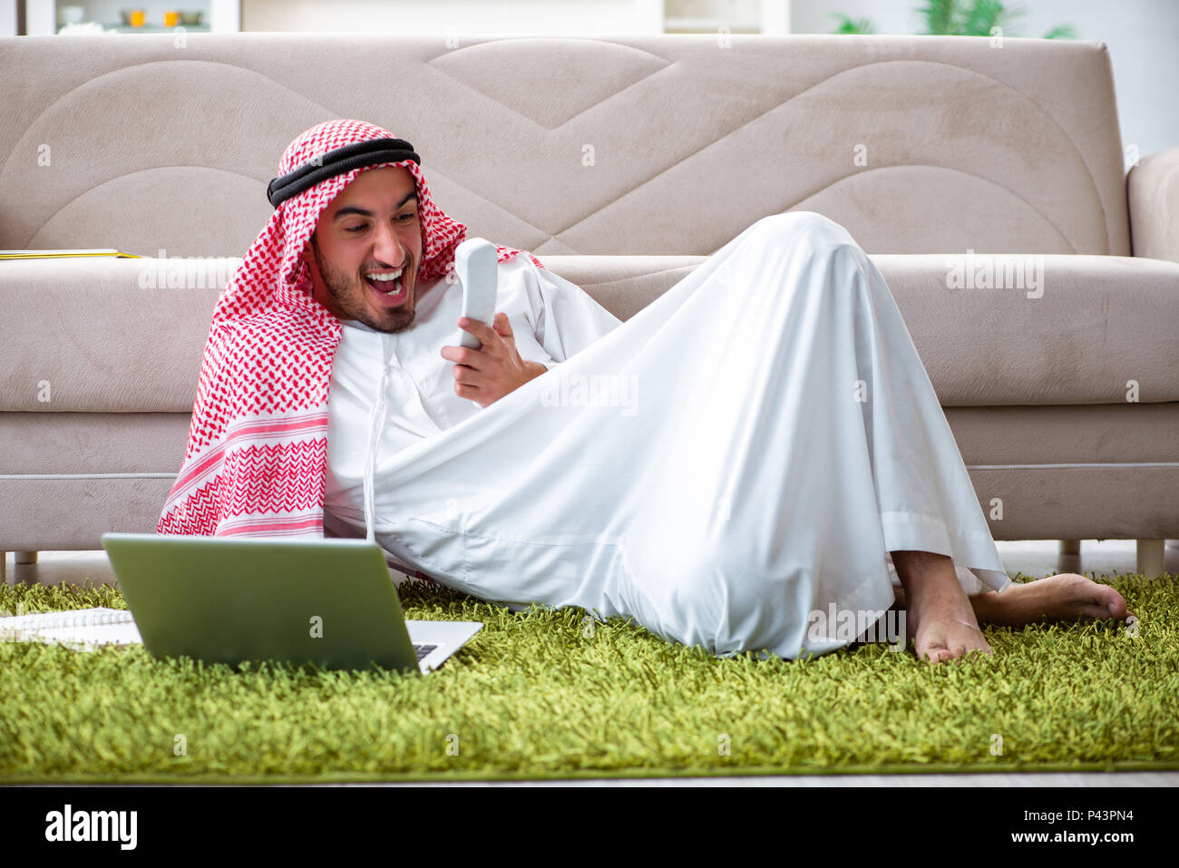 Arab man working at home on his work Stock Photo - Alamy