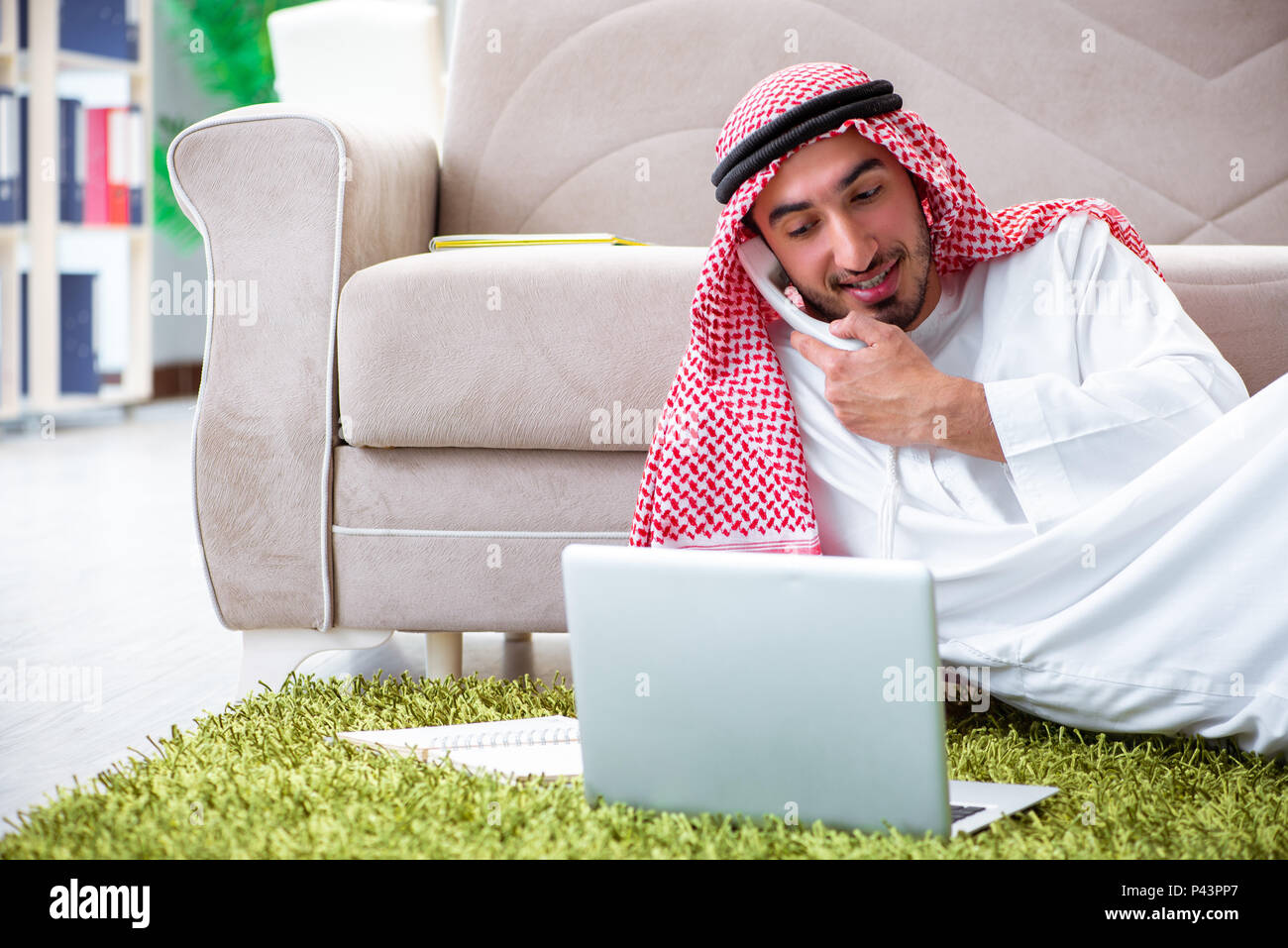 Arab man working at home on his work Stock Photo - Alamy