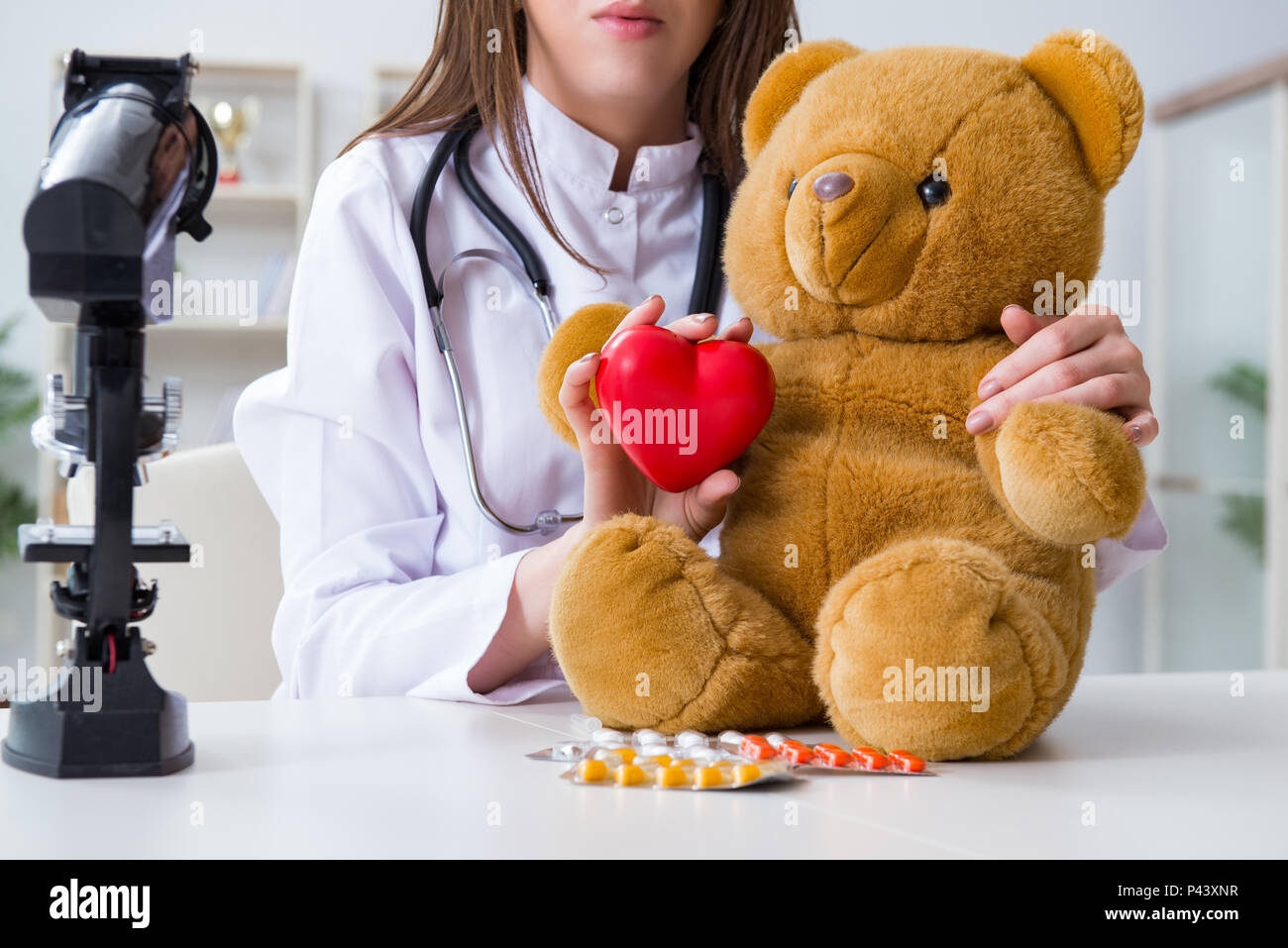 Child checking soft toy health Stock Photo - Alamy