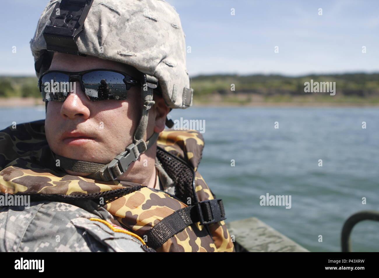 U.S. Army Sgt. Brandon LaBrie, boat operator, with the 200th Engineer ...