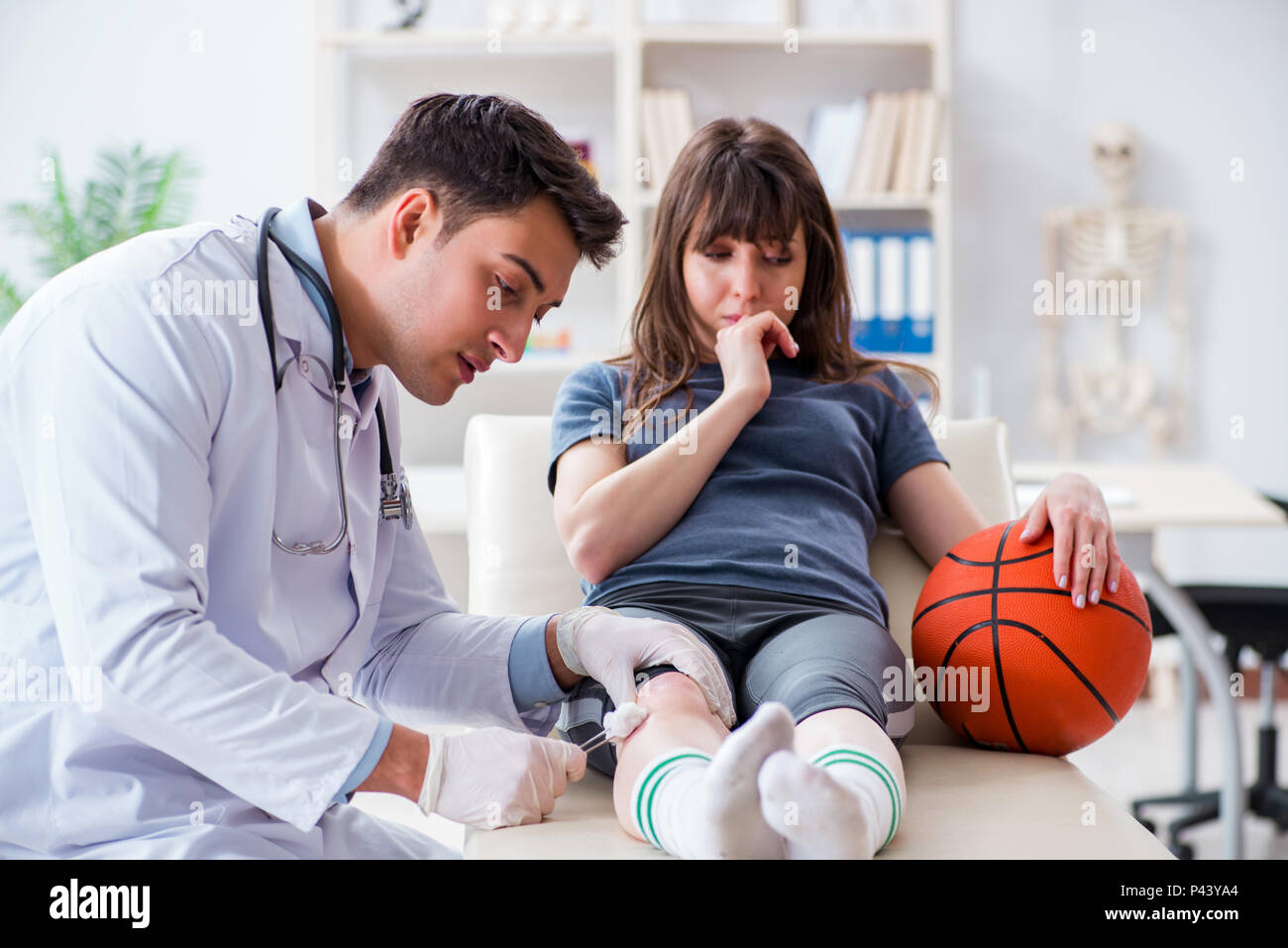 Female basketball player visiting doctor after injury Stock Photo - Alamy