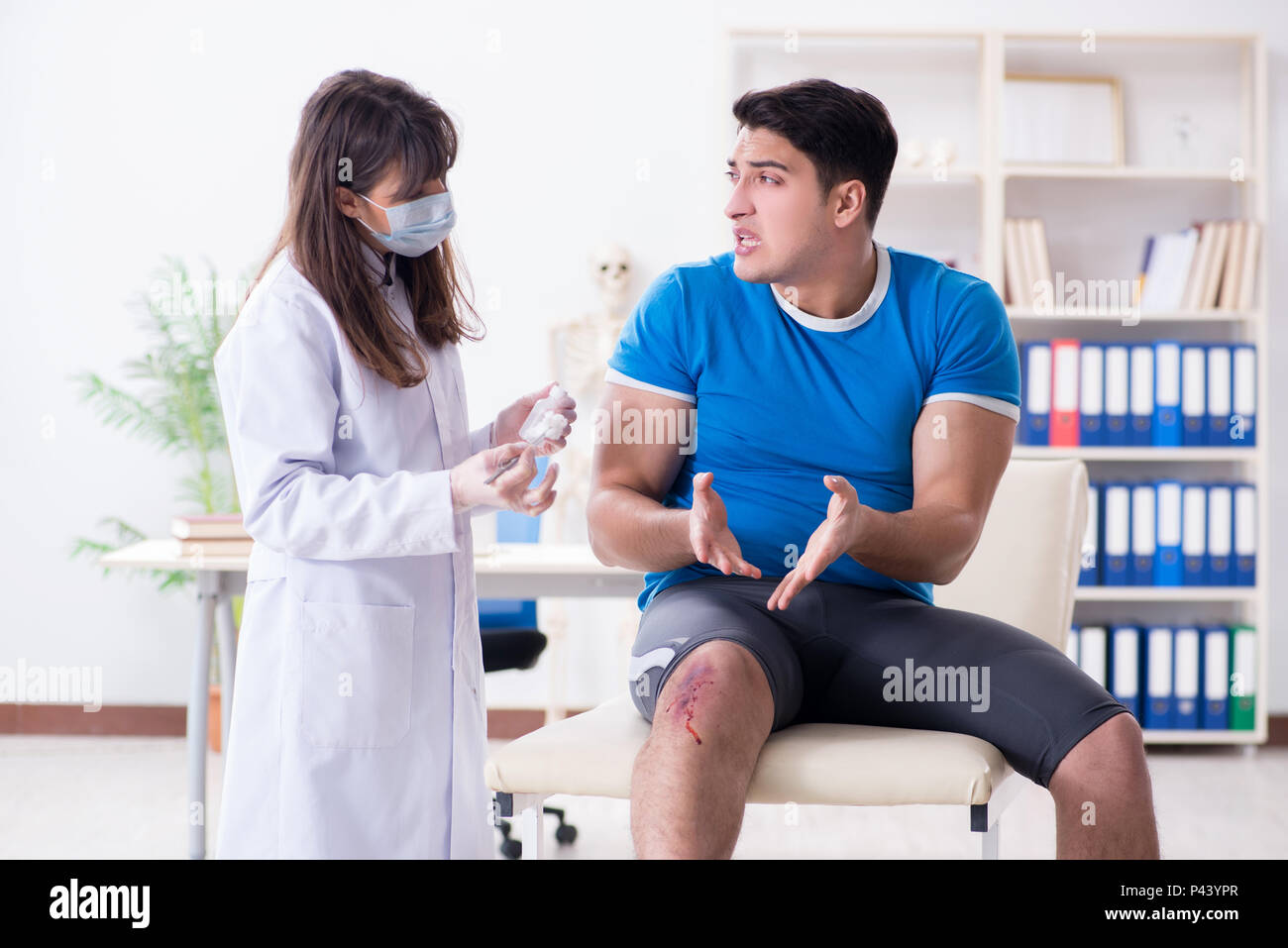 Patient visiting doctor after sustaining sports injury Stock Photo - Alamy