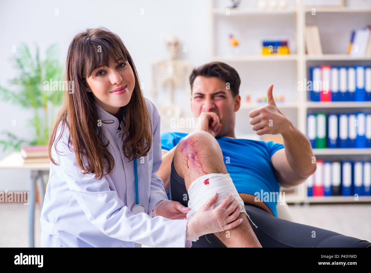 Patient visiting doctor after sustaining sports injury Stock Photo - Alamy
