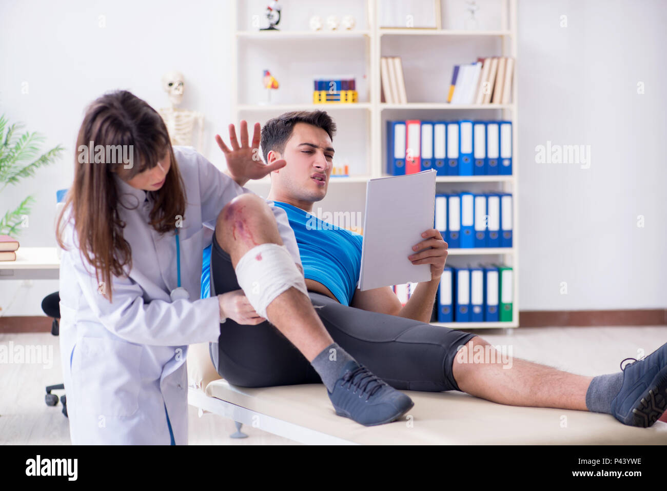 Patient visiting doctor after sustaining sports injury Stock Photo - Alamy