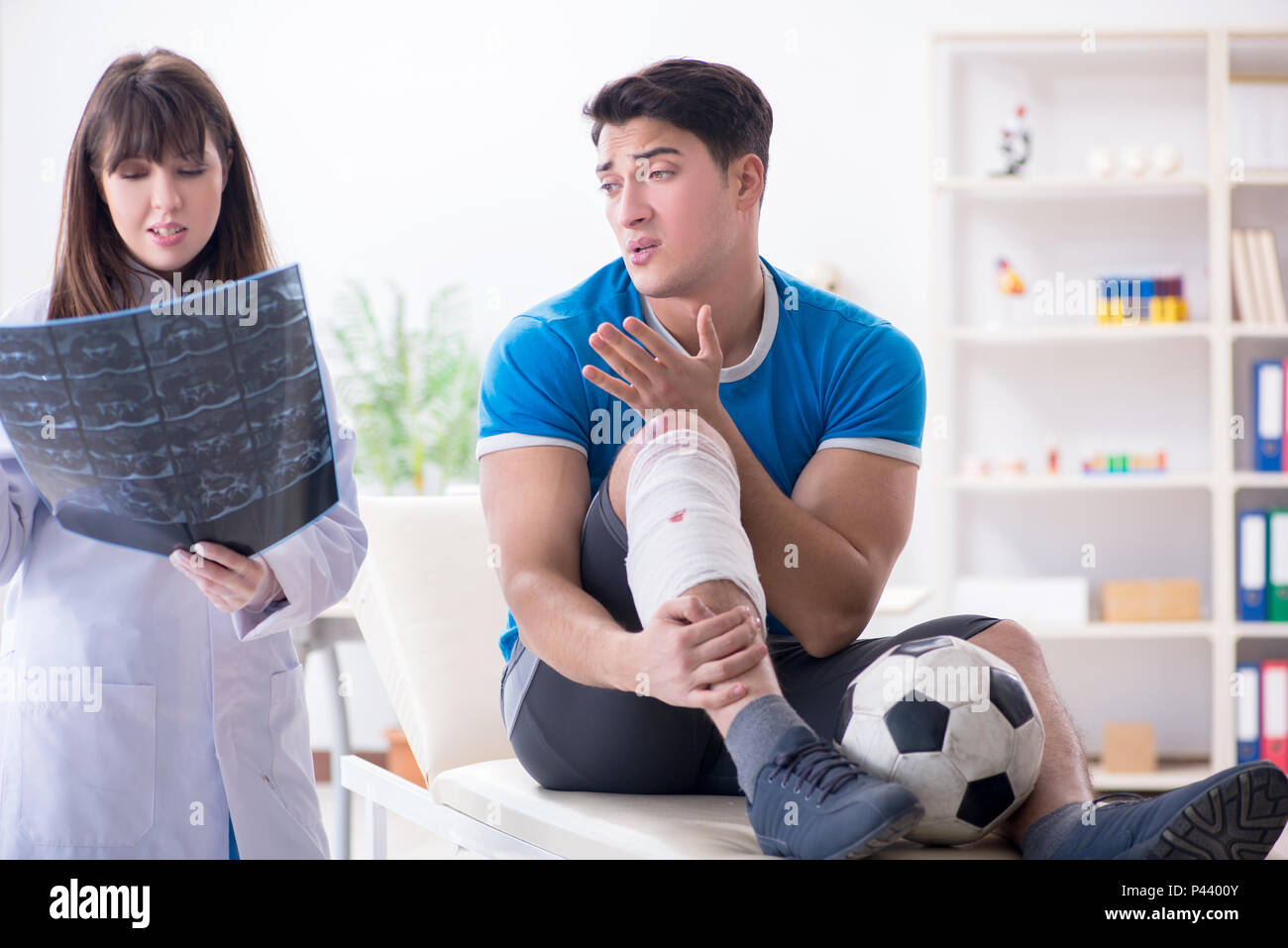 Football soccer player visiting doctor after injury Stock Photo - Alamy