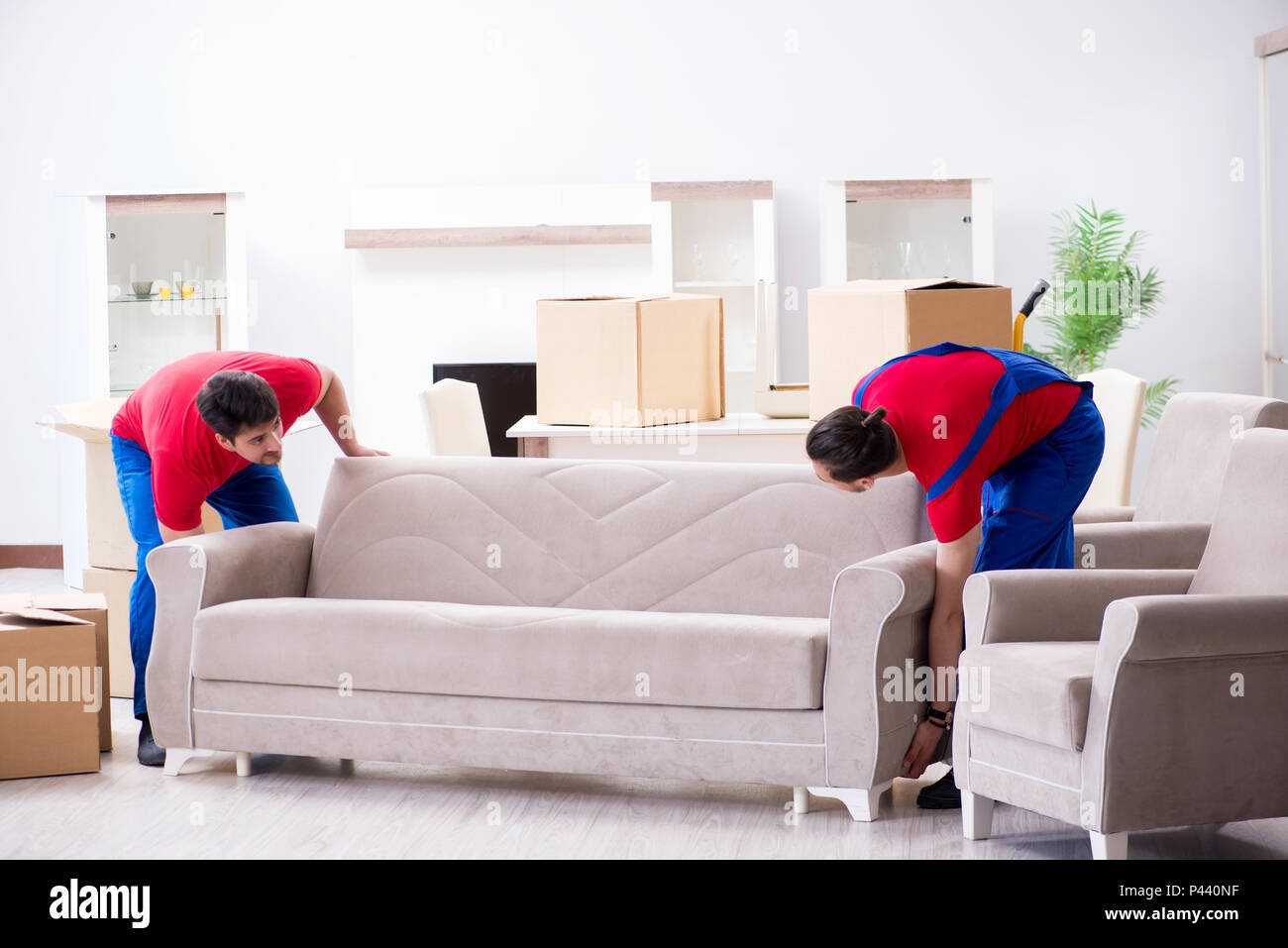 Two contractor employees moving personal belongings Stock Photo - Alamy