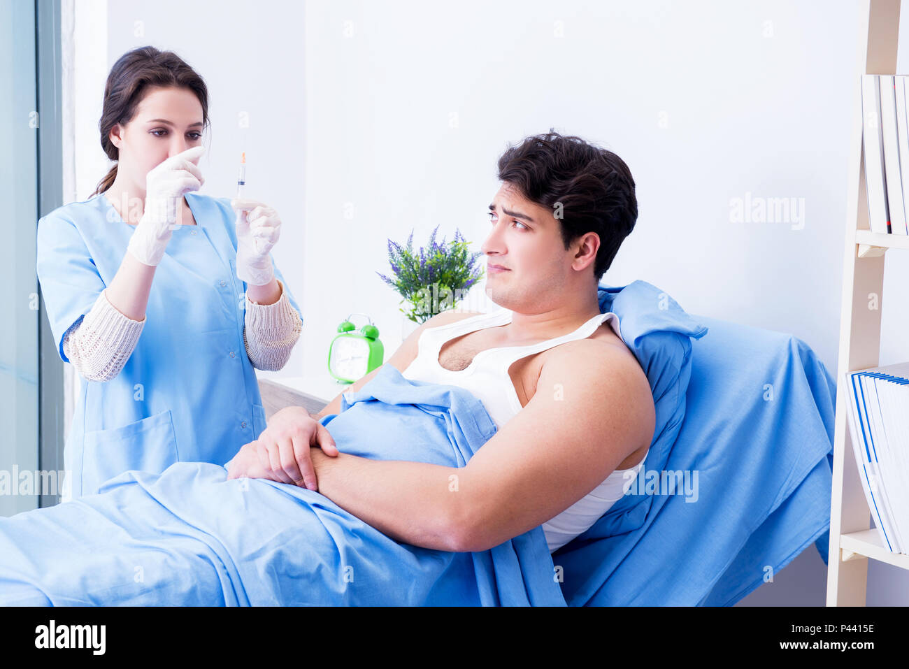 Doctor doing medical injection in hospital room Stock Photo - Alamy