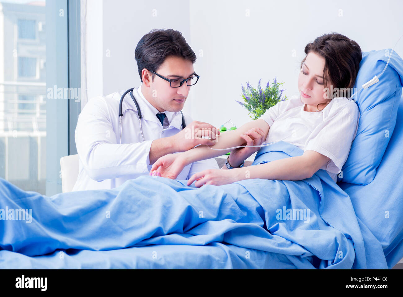 Doctor doing medical injection in hospital room Stock Photo - Alamy
