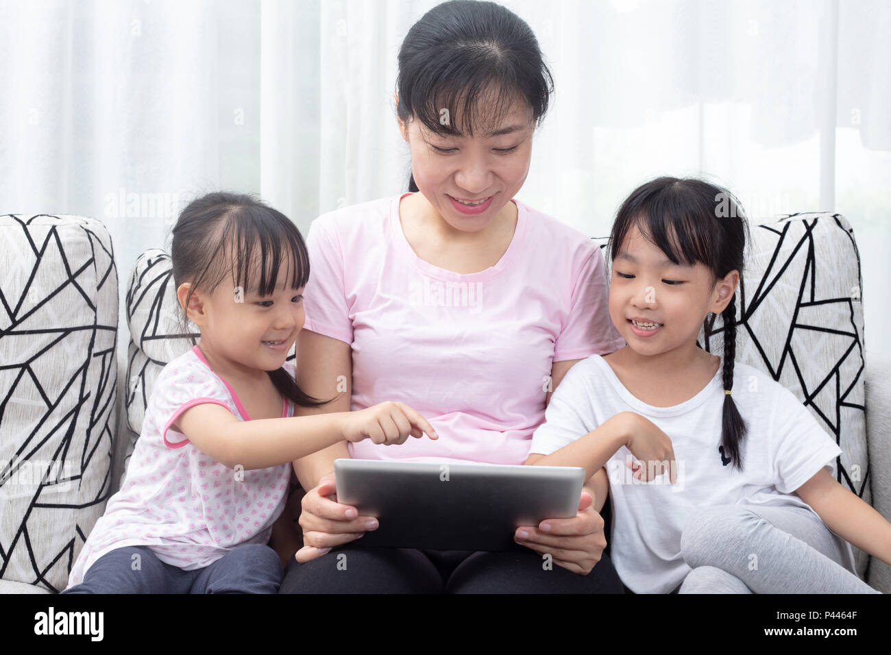 Happy Asian Chinese Family Playing with Digital Tablet Together at Home ...
