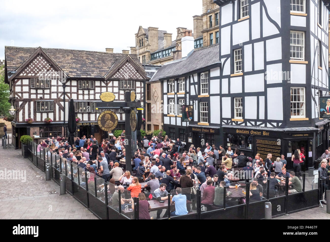 Crowds of drinkers at Sinclairs Oyster Bar and The Old Wellington pub ...