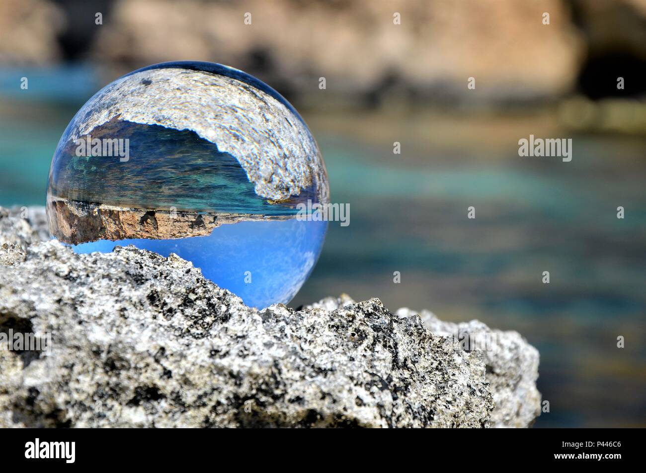 glass sphere on stone rocks Stock Photo - Alamy