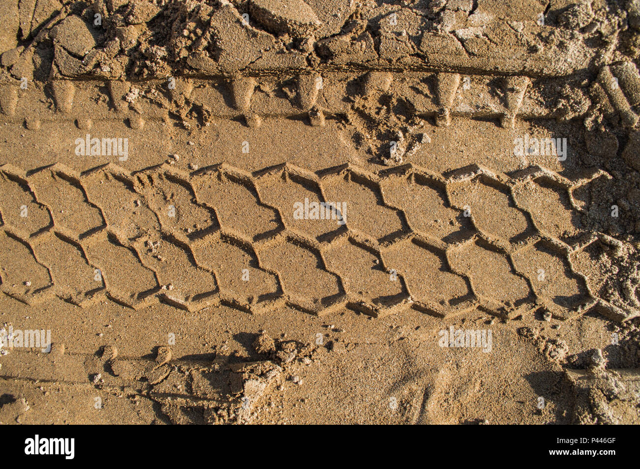 Wheel car footprints on the sand Stock Photo - Alamy