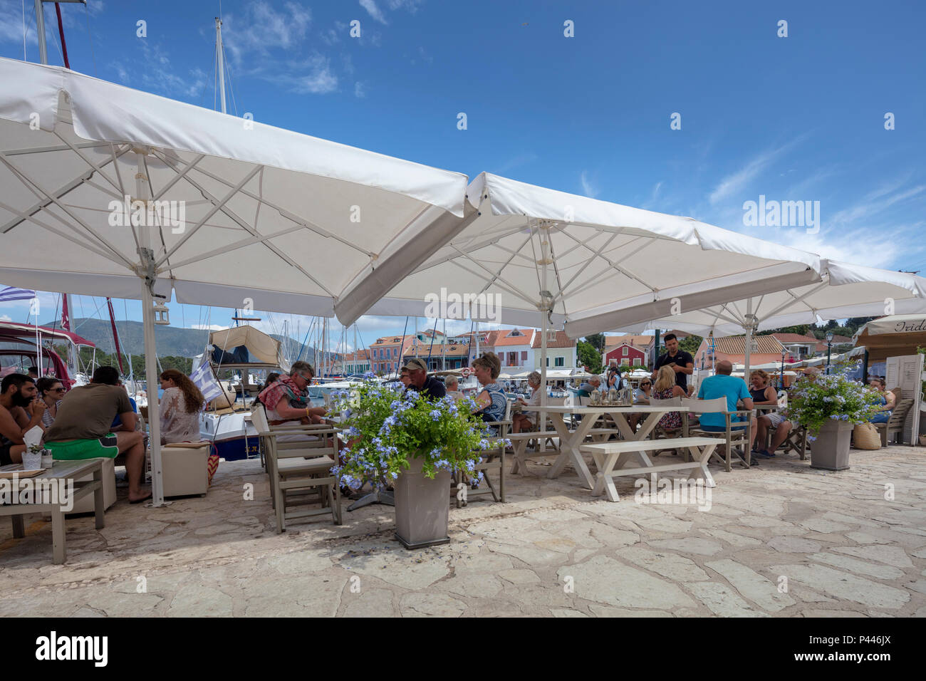 waterfront restaurant tables, Fiskardo, Cephalonia, Greece Stock Photo ...