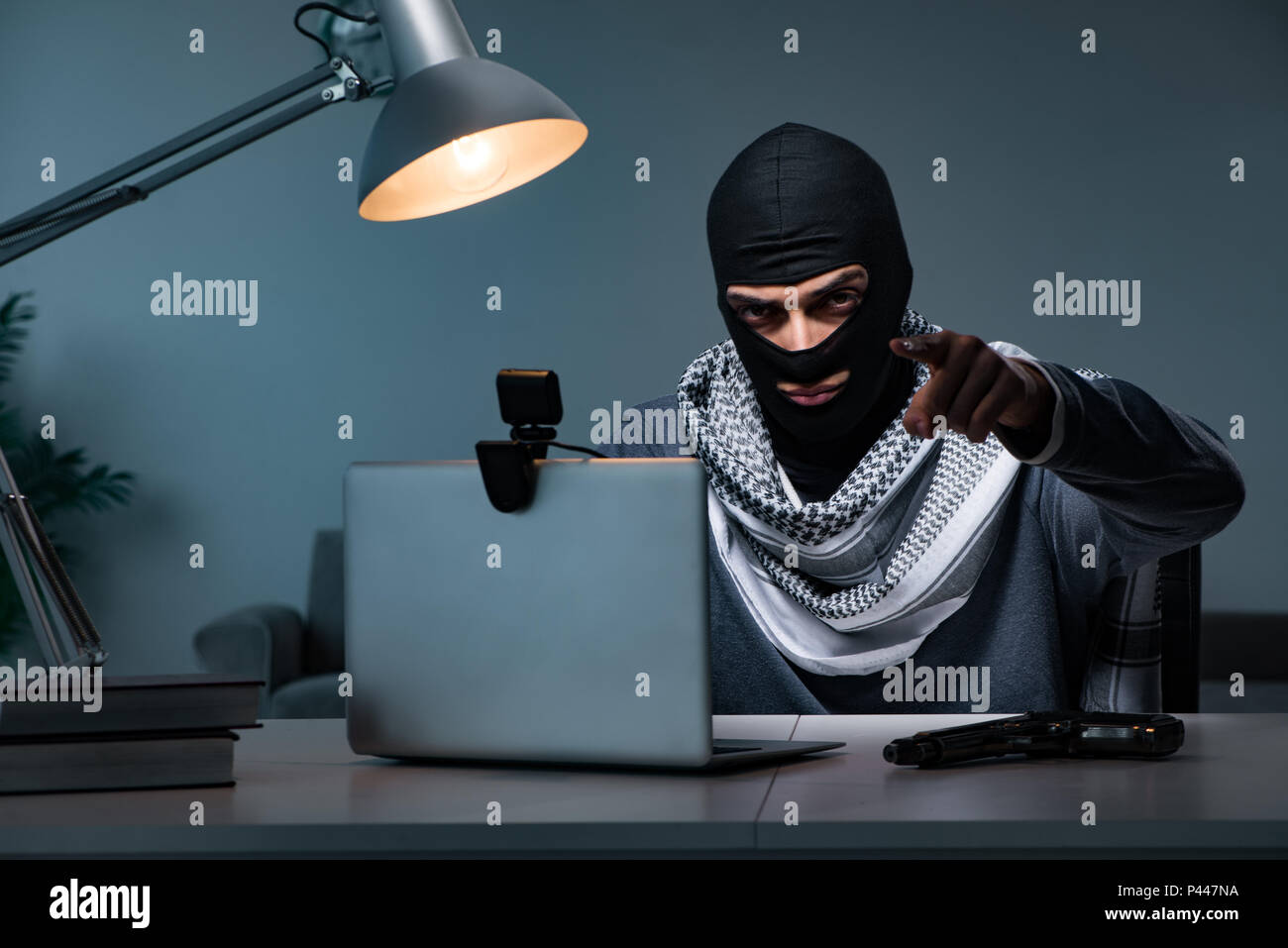 Hacker wearing balaclava mask hacking computer Stock Photo - Alamy
