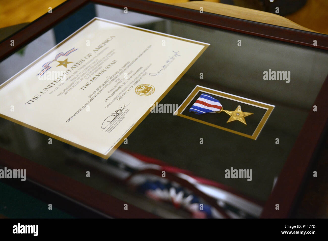 A framed Silver Star Medal and citation await presentation to Sgt. 1st ...