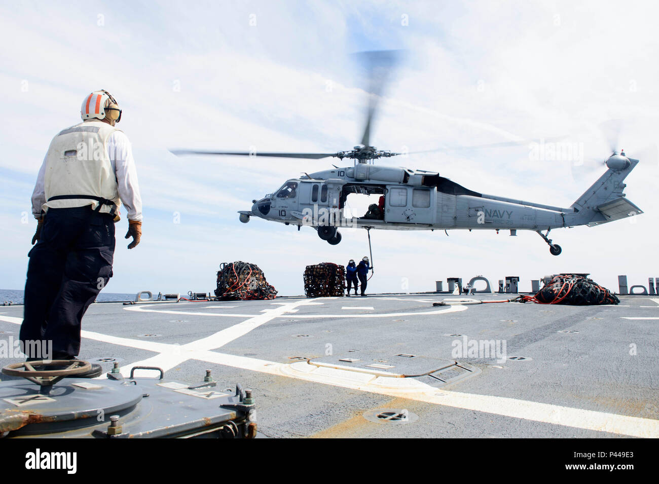 Boatswain’s Mate Omar Navarro, assigned to the Arleigh Burke-class ...