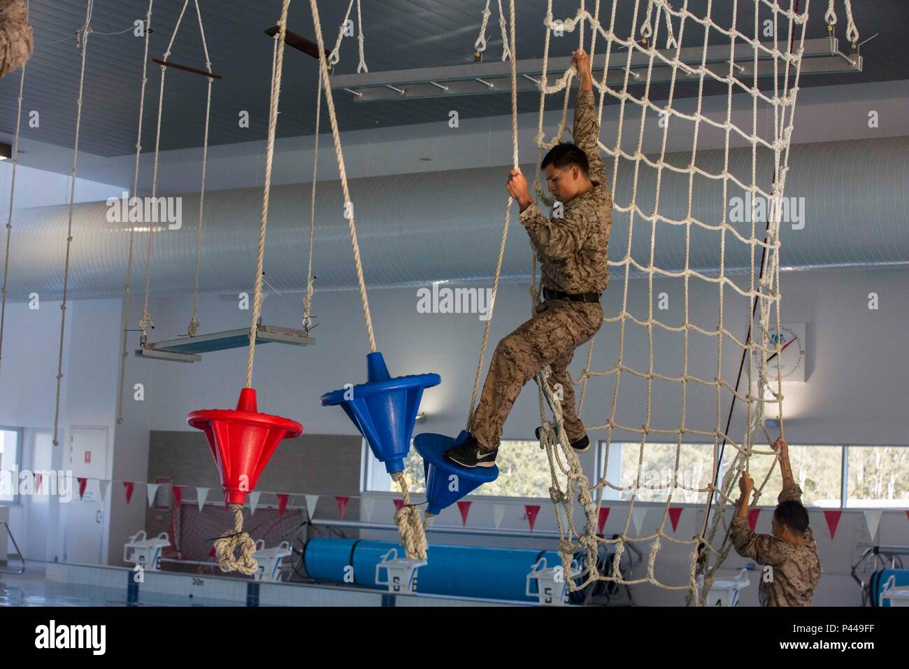 U.S. Marine Corps Cpl. Sean E. Rodriquez, a team leader, passes from ...