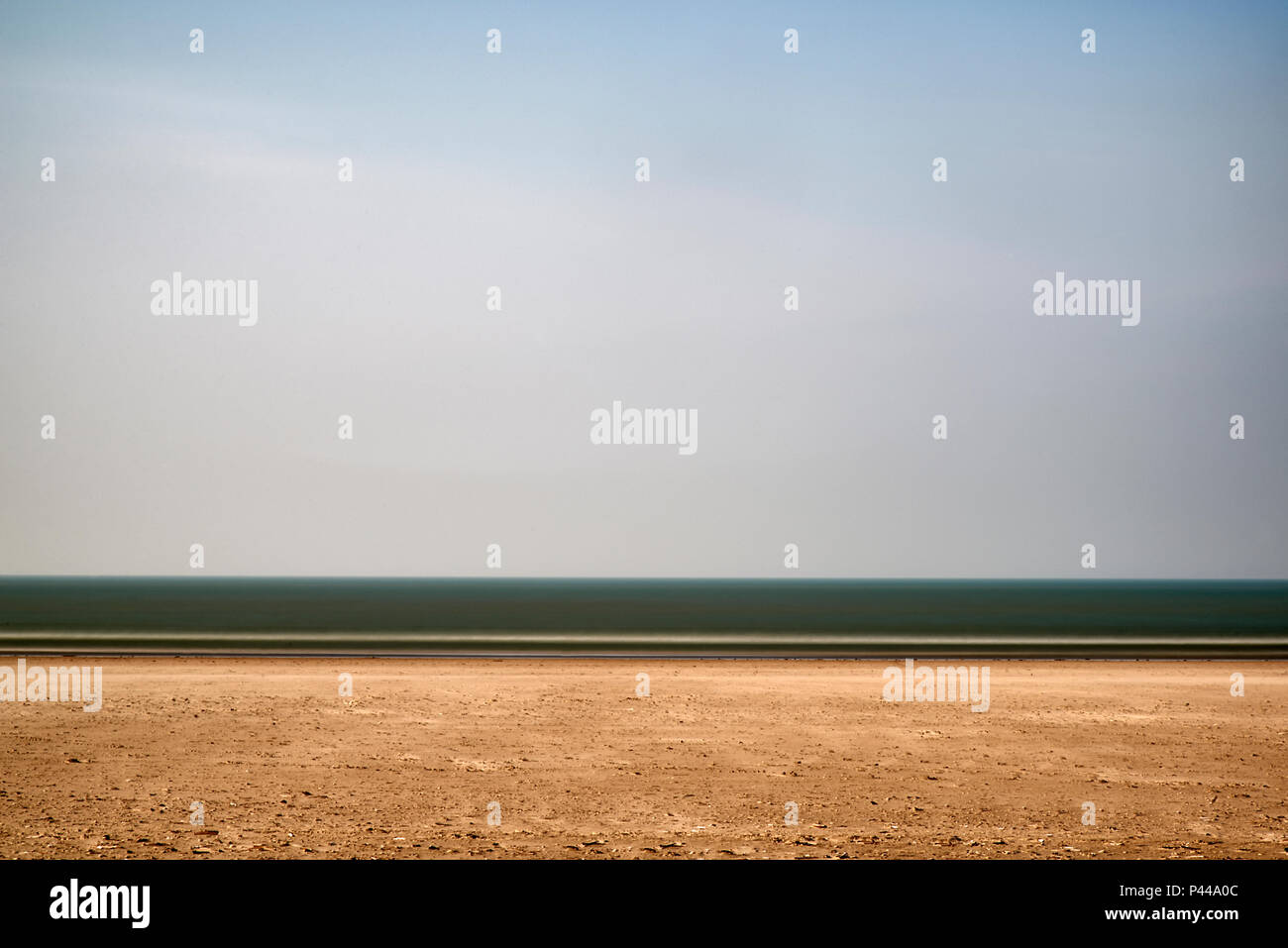 Abstract long exposure landscape of the beach and the shoreline with ...