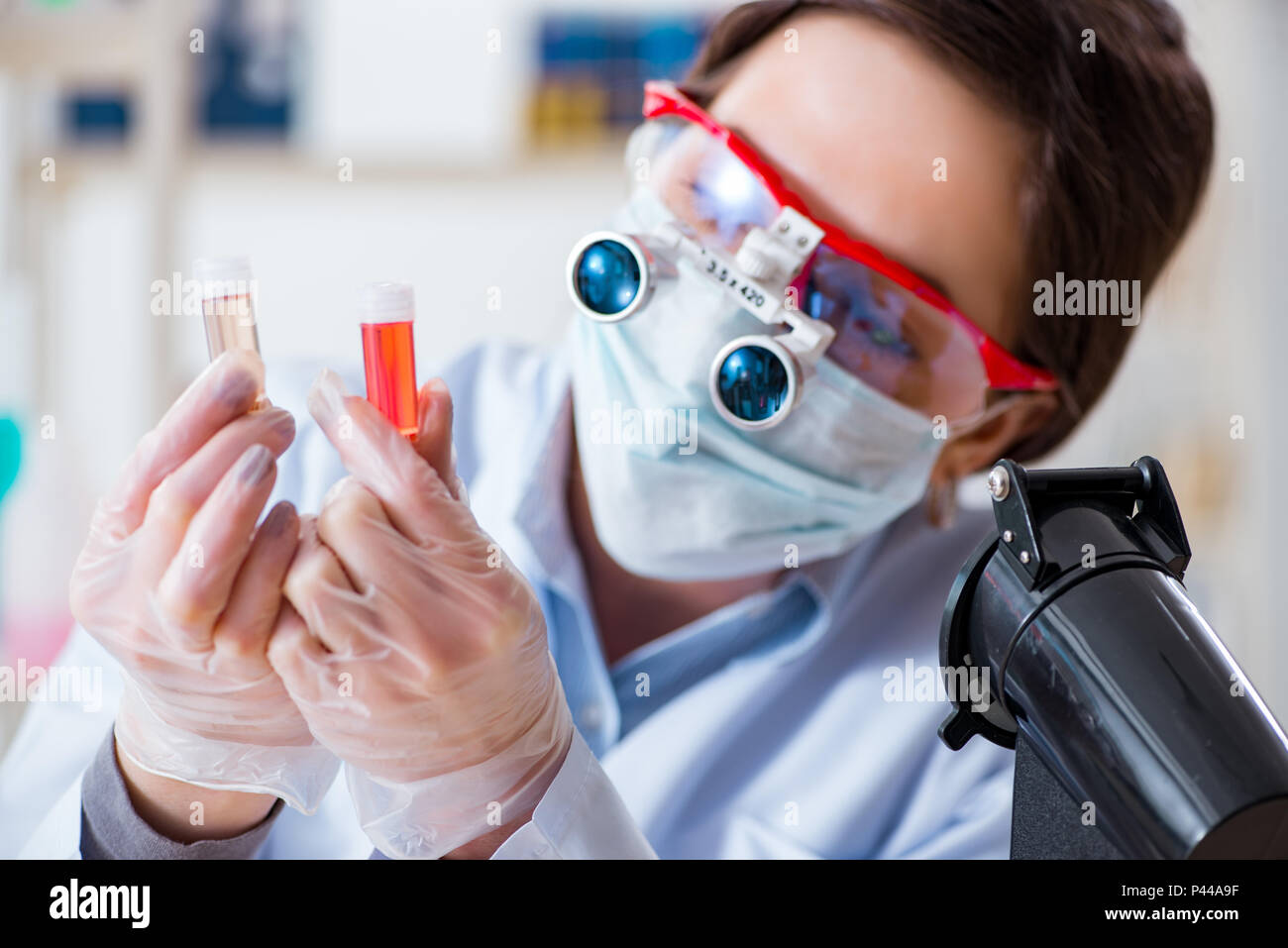 Lab assistant in drug synthesis concept Stock Photo - Alamy