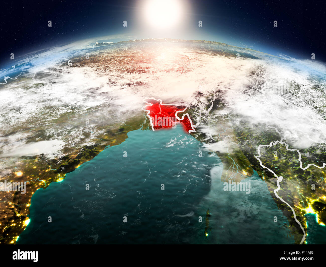 Sunrise above Bangladesh highlighted in red on model of planet Earth in space with visible ...