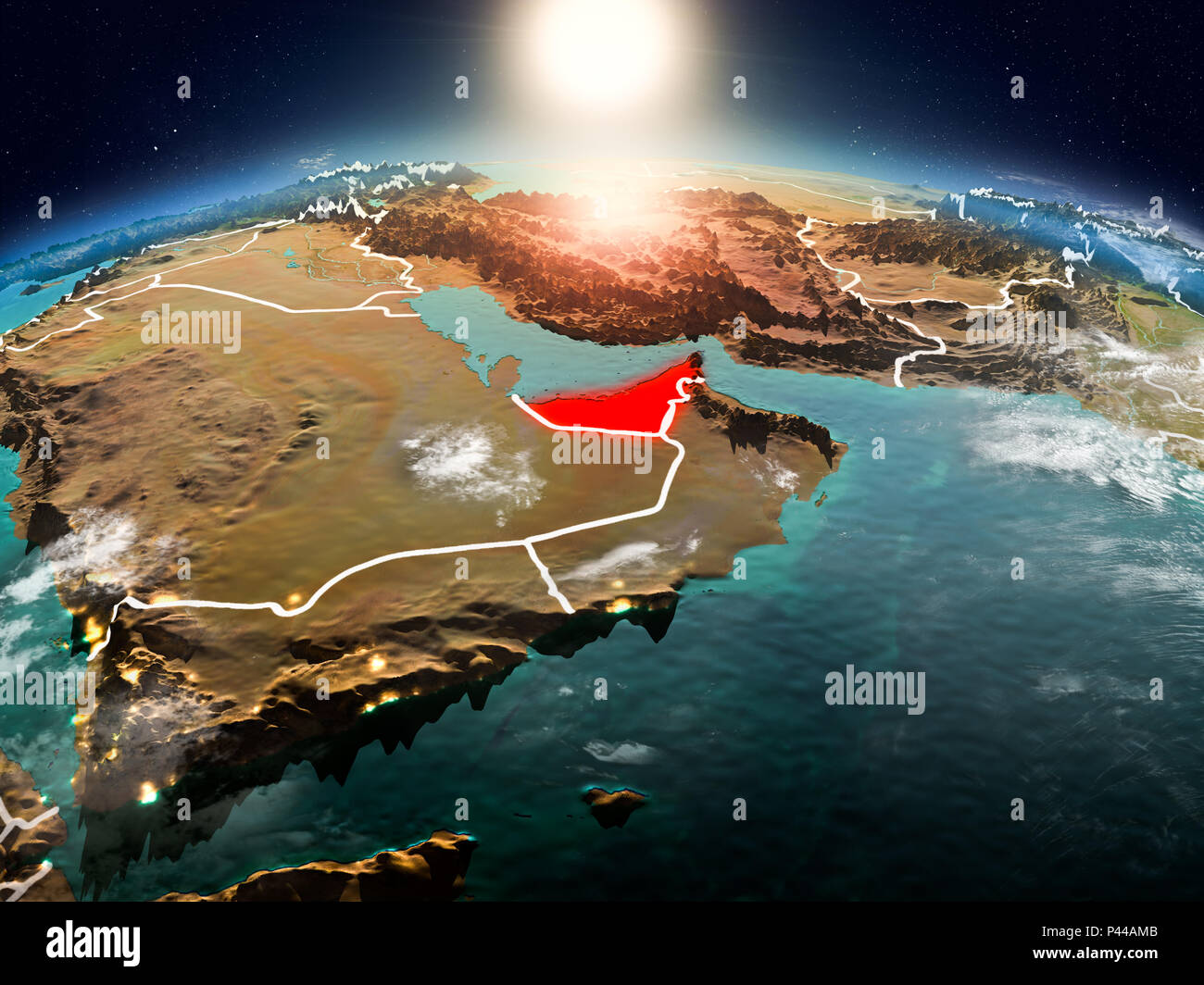 Sunrise above United Arab Emirates highlighted in red on model of ...