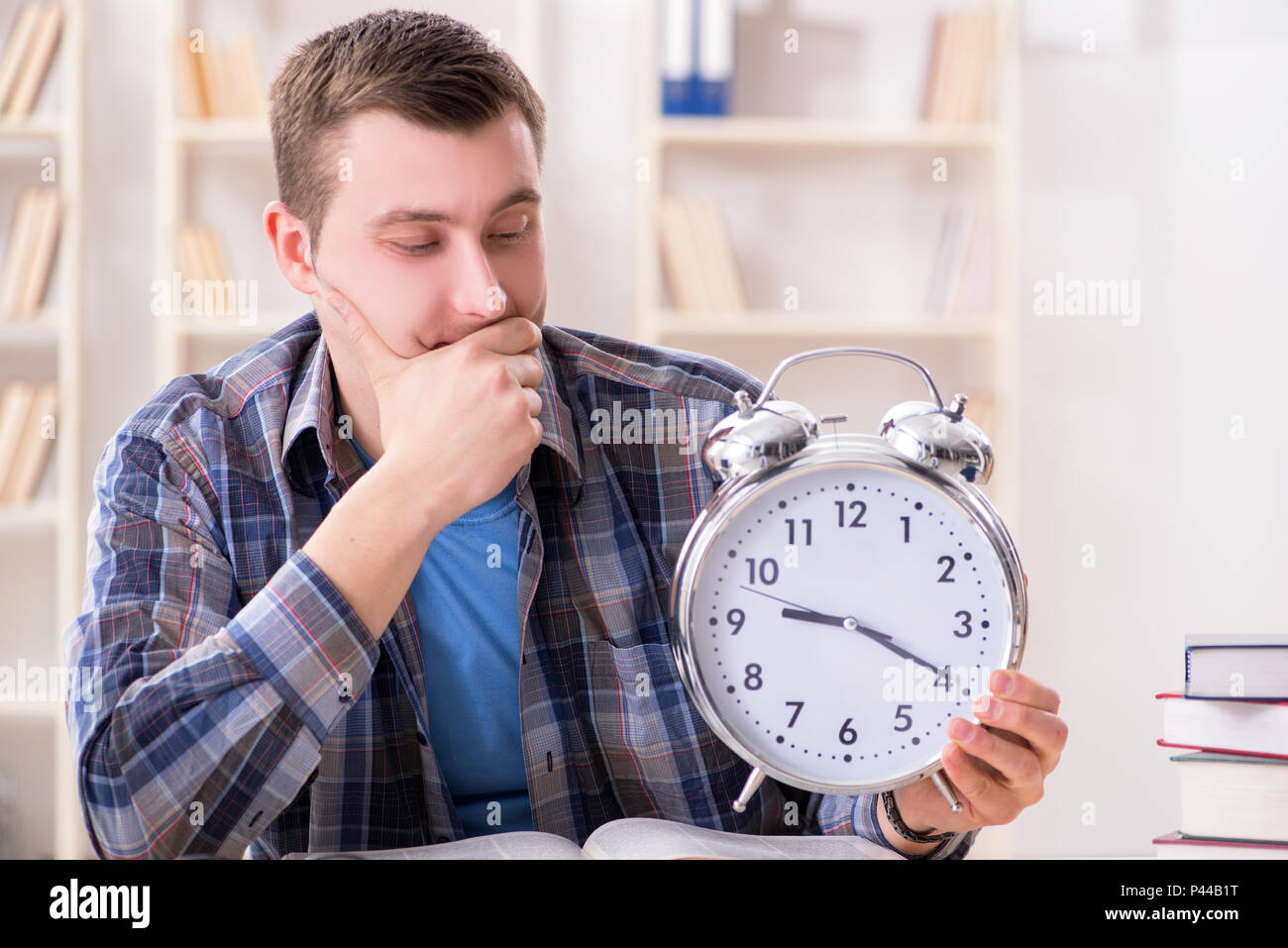 Student getting late with exam preparation Stock Photo - Alamy