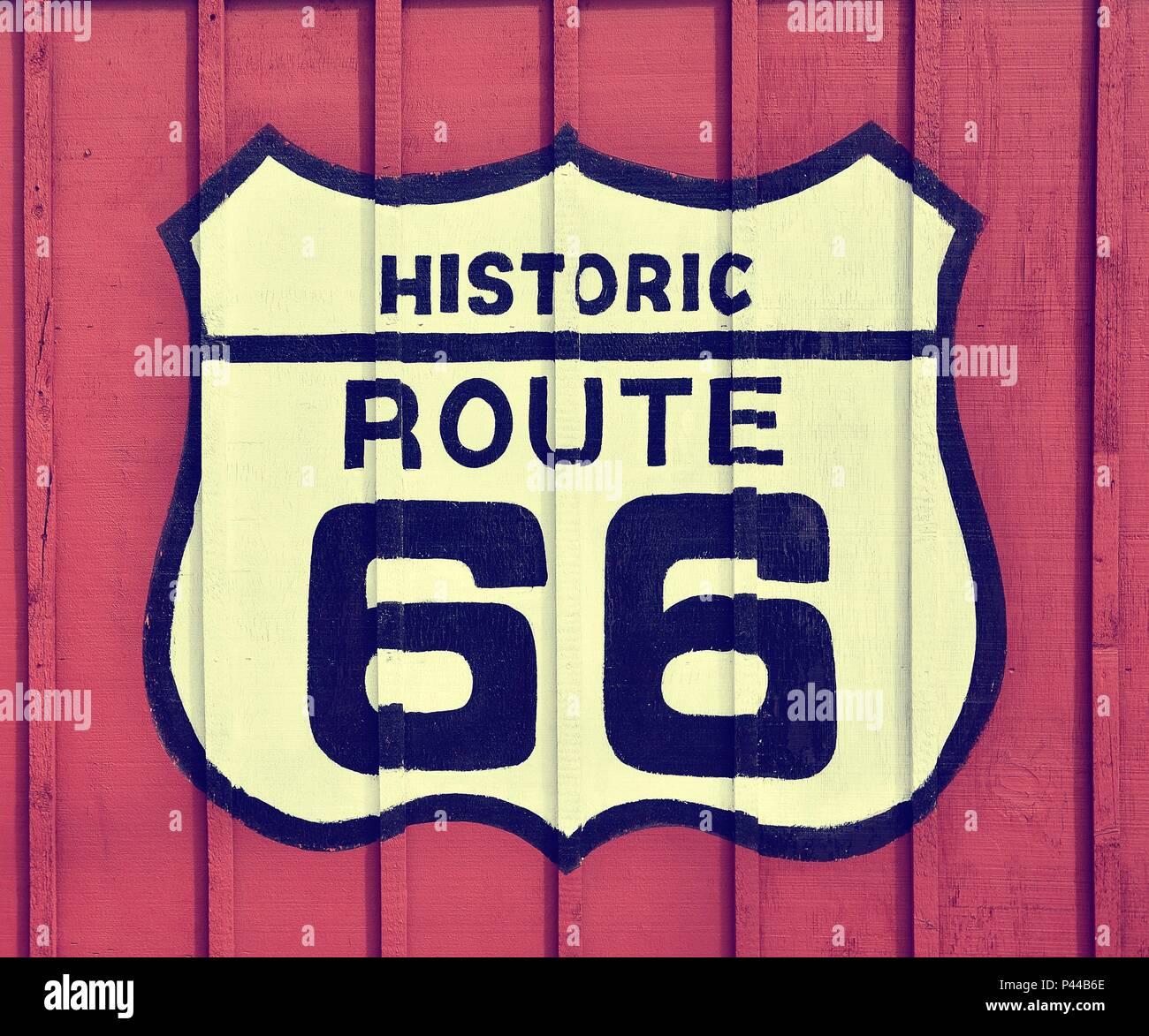 Historic U.S. old Route 66 sign with wooden background Stock Photo - Alamy