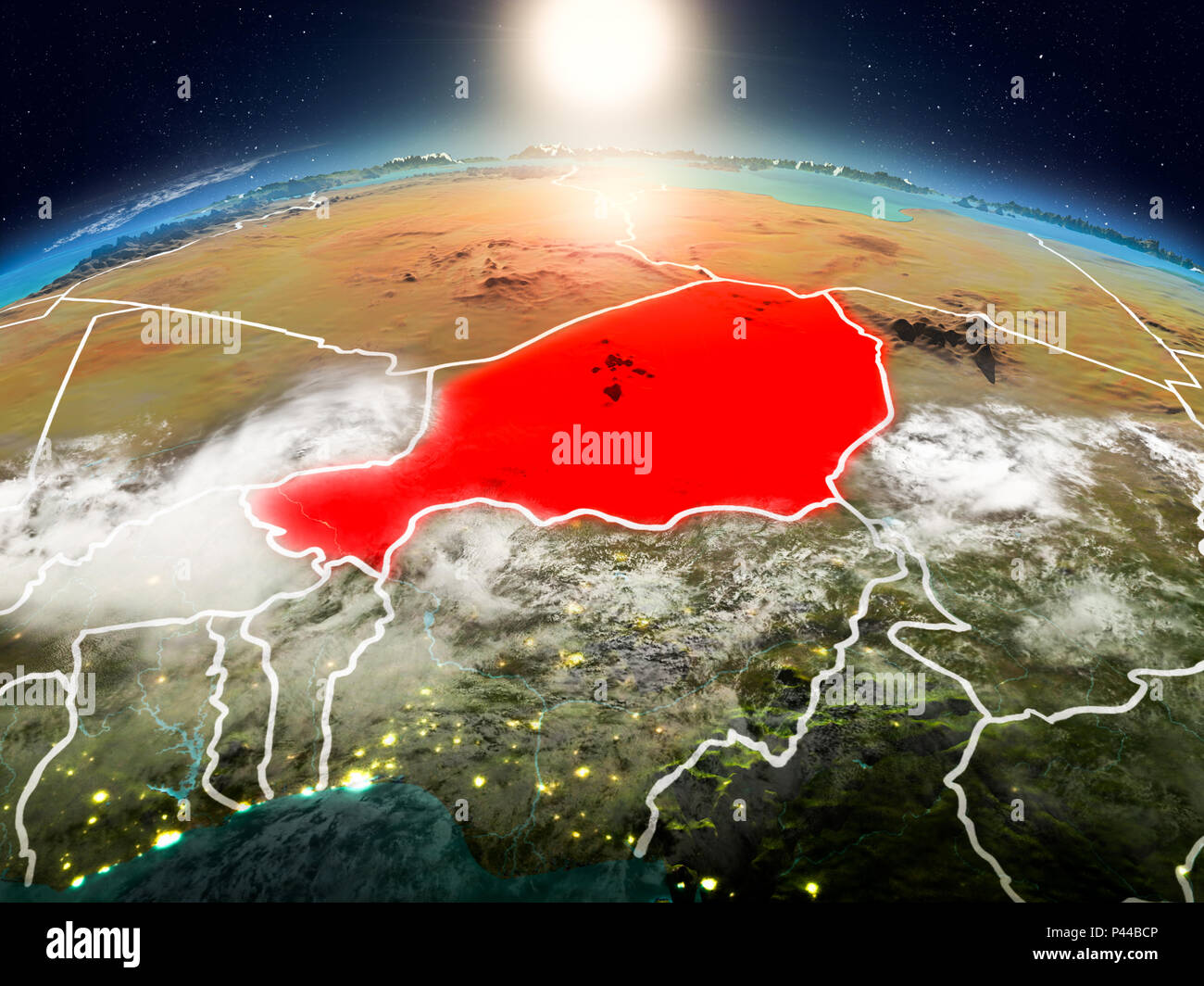 Sunrise above Niger highlighted in red on model of planet Earth in ...