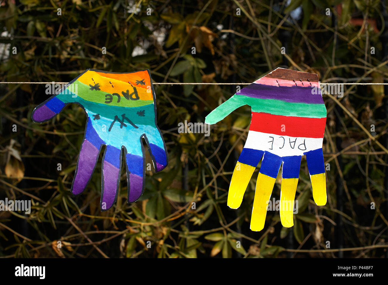 some hands of cards with the symbol pf peace,demonstration for peace ...