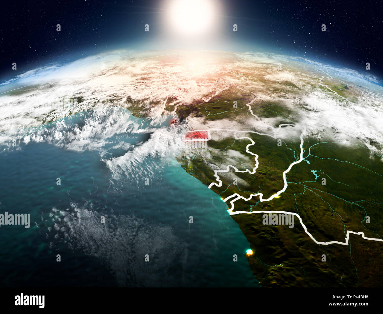 Sunrise above Equatorial Guinea highlighted in red on model of planet ...