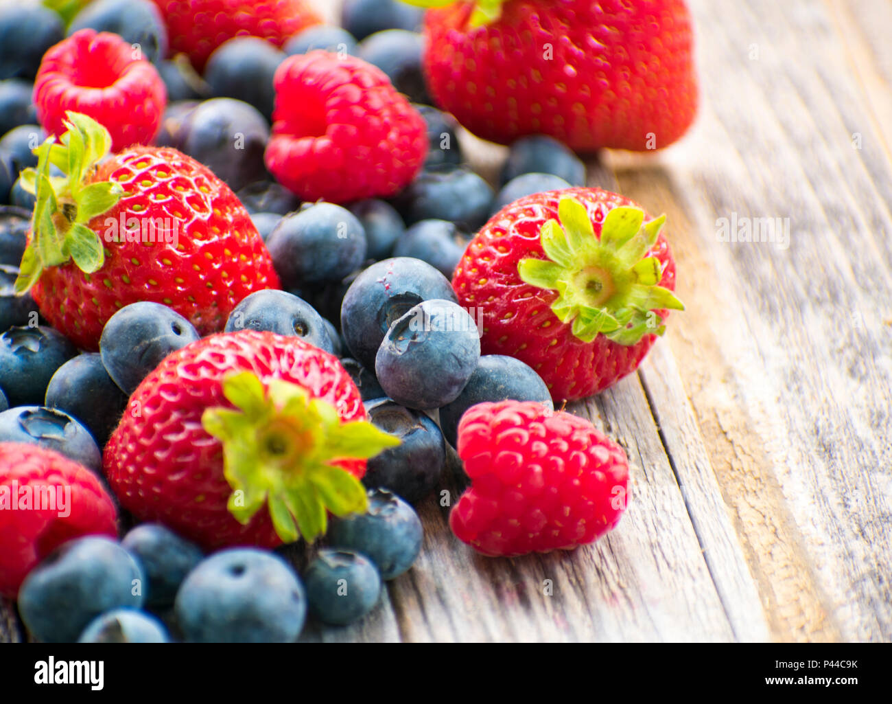 blueberries raspberries and strawberries Stock Photo - Alamy