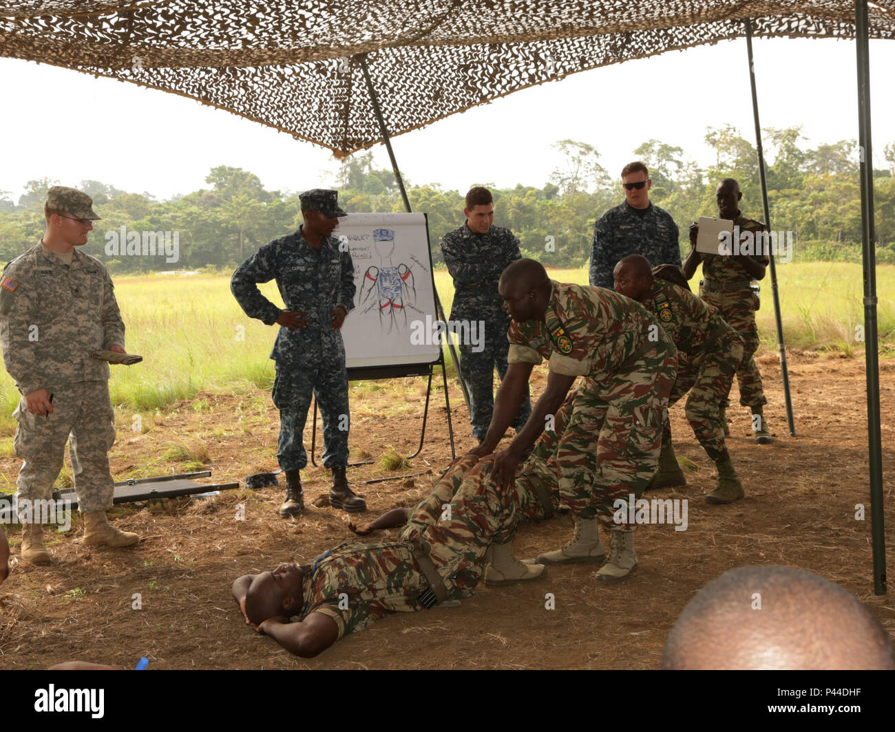 Cameroon soldiers demonstrate how to perform a fireman's carry during ...