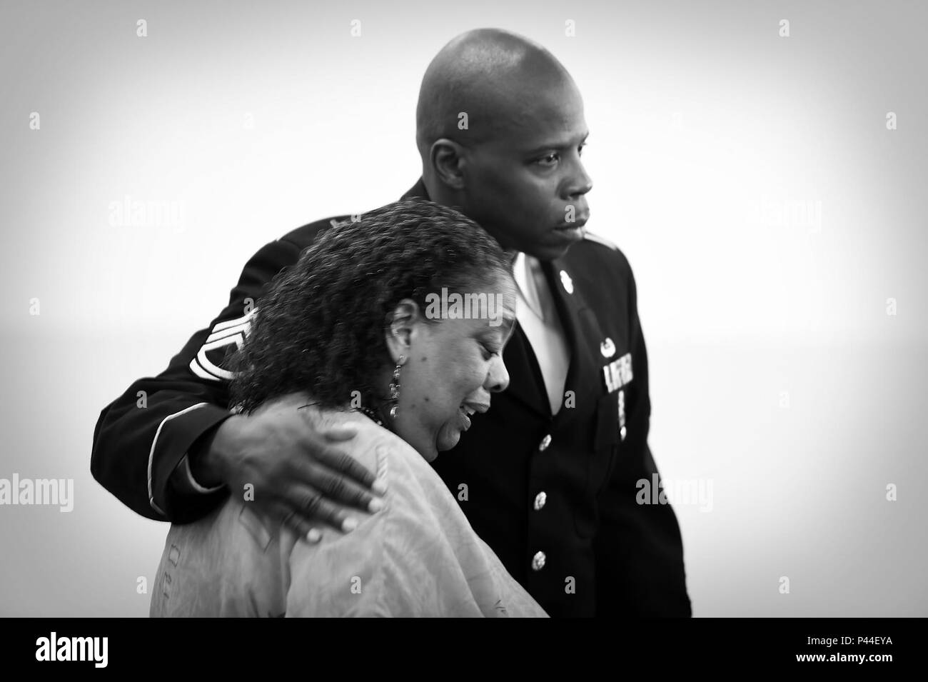 Virginia “Ginnie” Stephens is comforted by Sgt. First Class Gregory ...