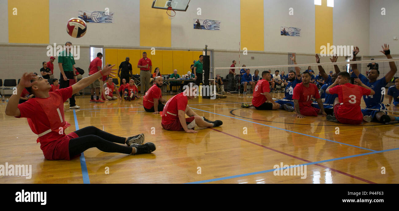 U.S. Marine Corps Lance Cpl. Robert Anfinson serves the ball during a ...