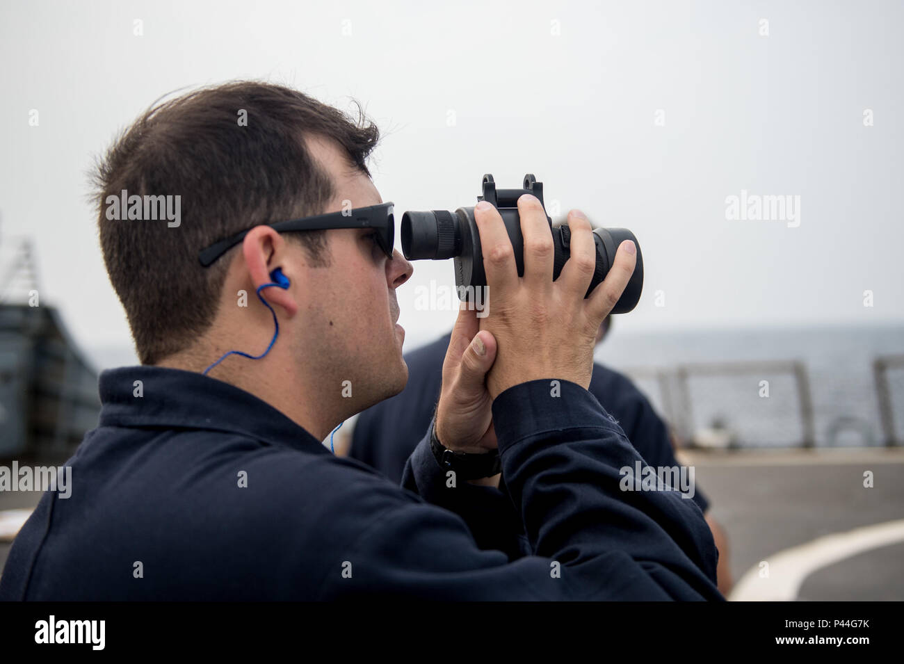 160627-N-UF697-187 YELLOW SEA (June 27, 2016) Ensign Thomas W. Jones ...