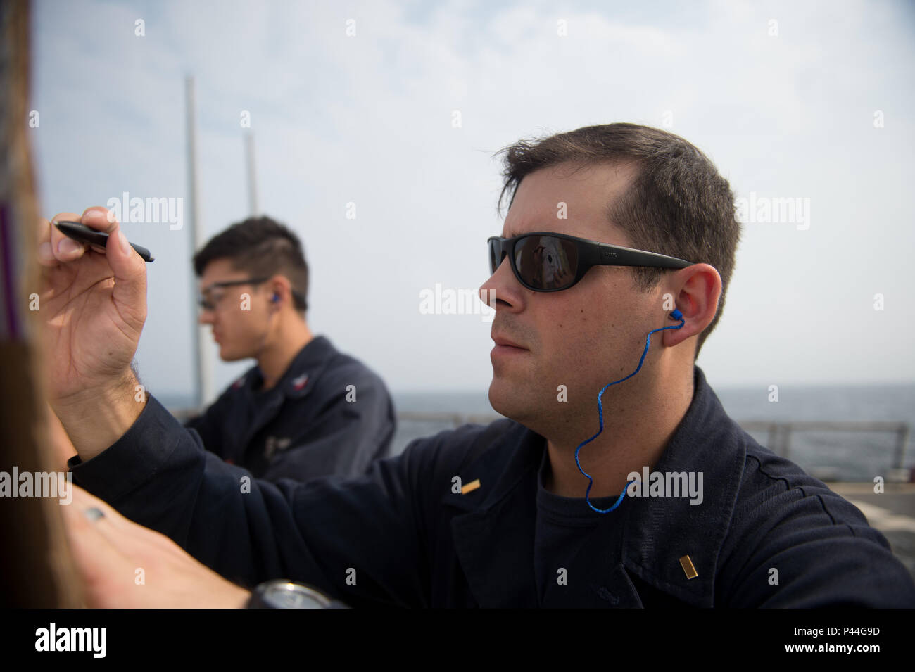 160627-N-UF697-373 YELLOW SEA (June 27, 2016) Ensign Thomas W. Jones ...
