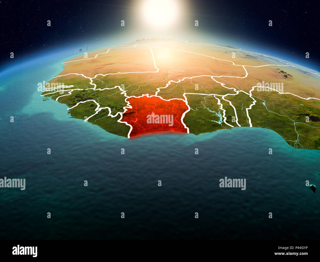 Sunrise above Ivory Coast highlighted in red on model of planet Earth ...