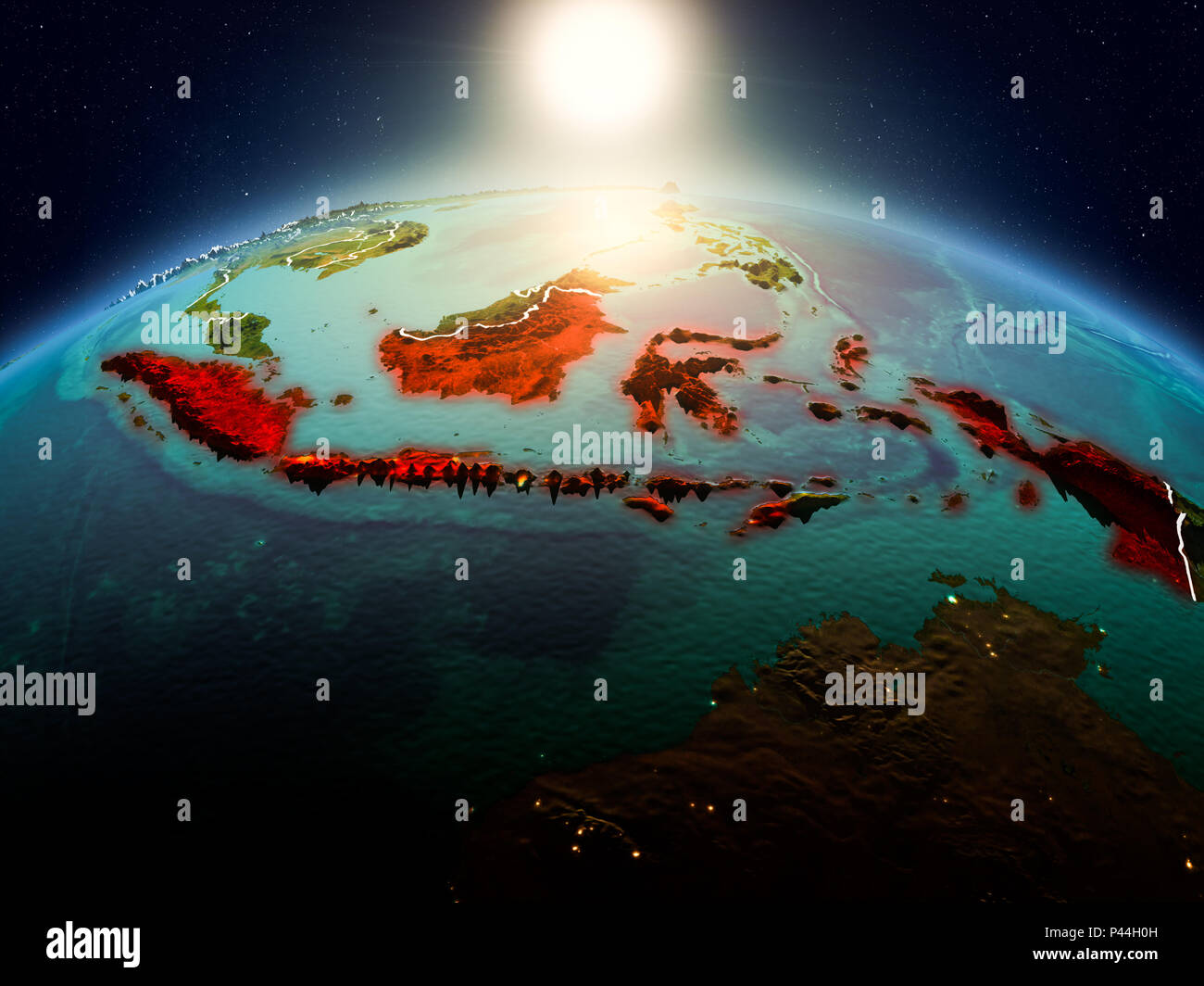 Sunrise above Indonesia highlighted in red on model of planet Earth in ...