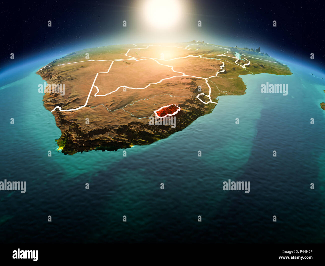 Sunrise above Lesotho highlighted in red on model of planet Earth in ...