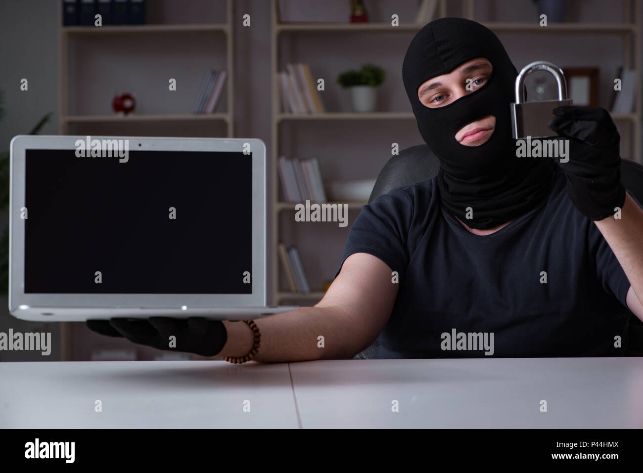 Hacker hacking computer late at night Stock Photo - Alamy
