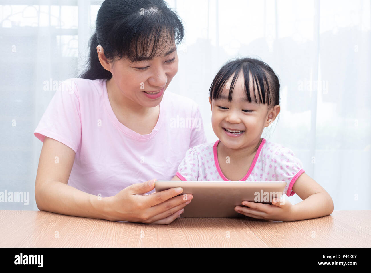 Happy Asian Chinese Family Playing with Digital Tablet Together at Home ...