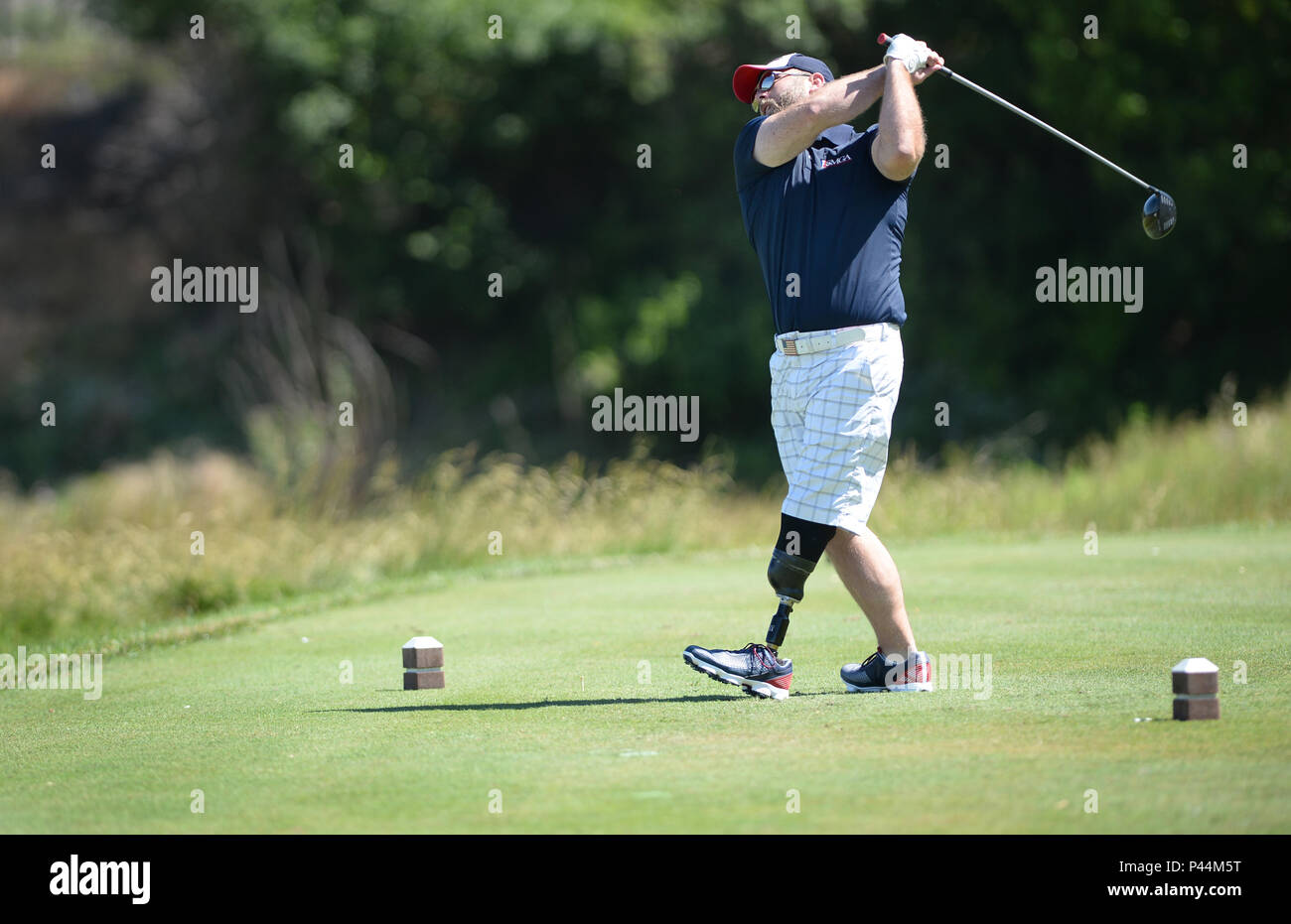 Wounded Warrior Veteran, Chris Bowers (USMC) tee off during the 9th ...