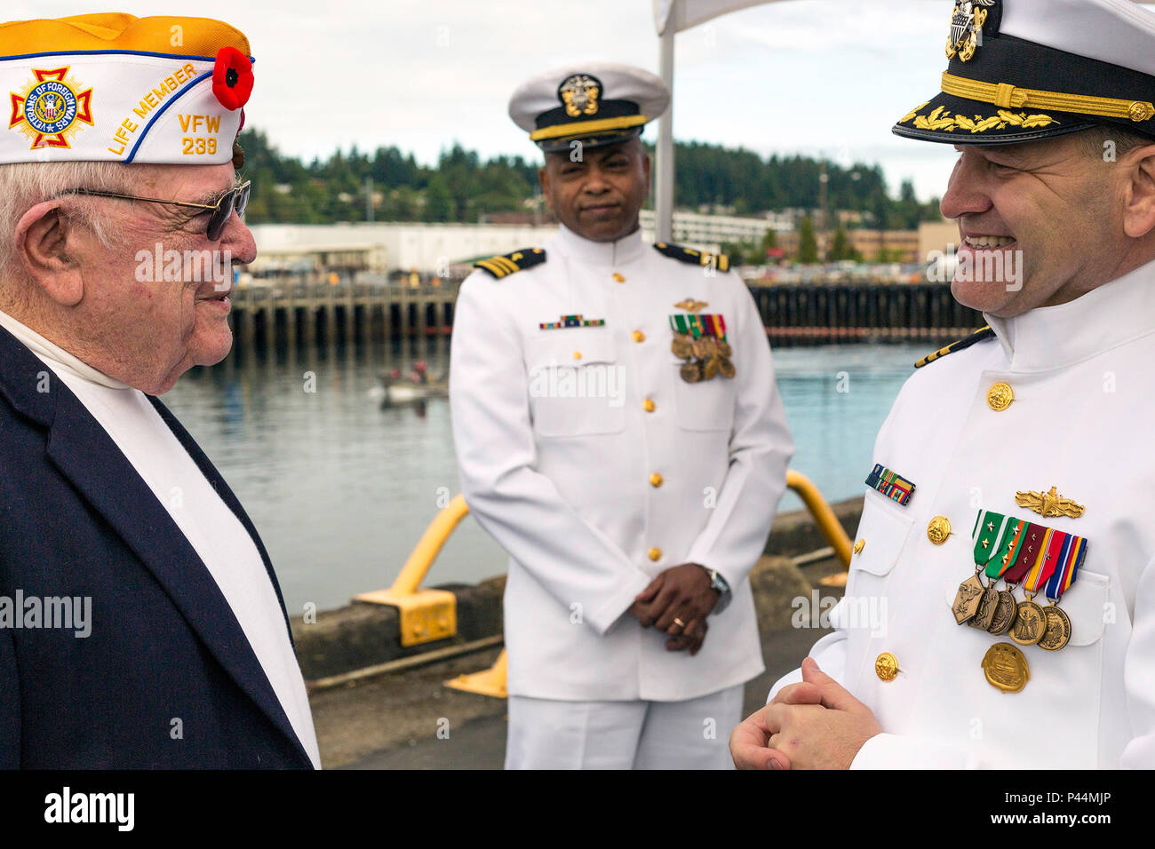 Retired Navy Capt. Will Lent (left) speaks with Cmdr. Tony Pecoraro ...