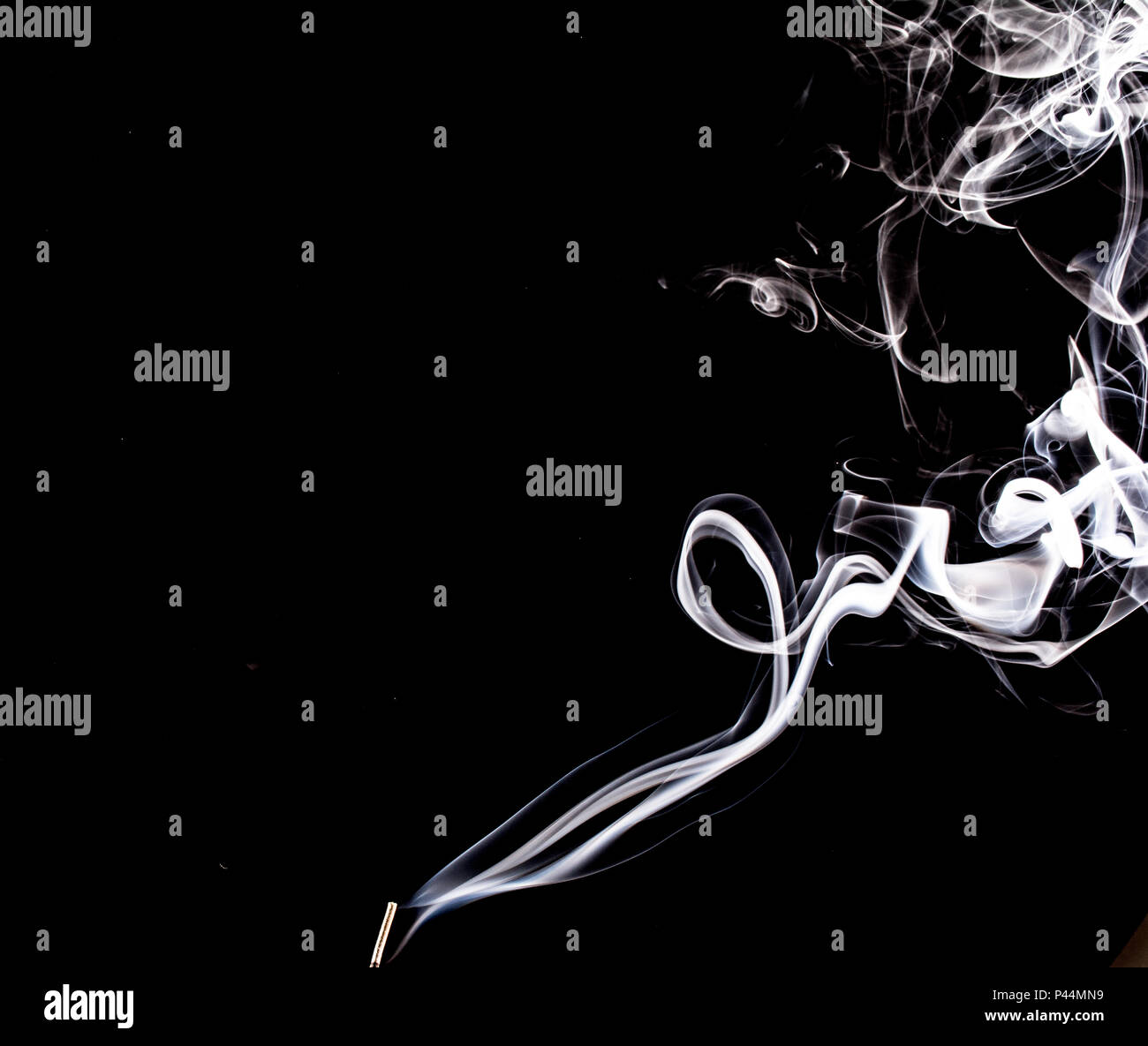 Movement of smoke isolated on black background Stock Photo - Alamy