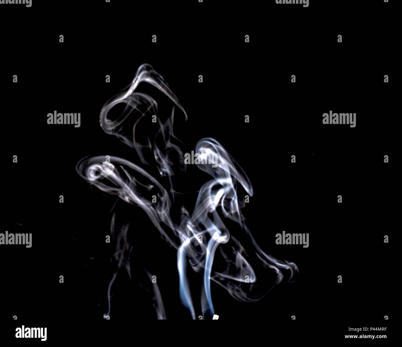 Movement of smoke isolated on black background Stock Photo - Alamy