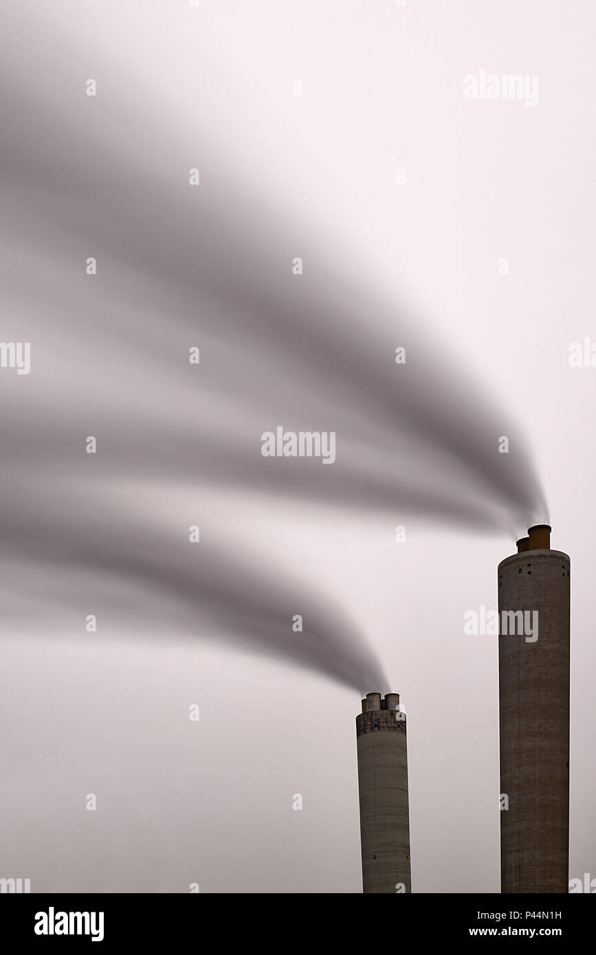 Close up of an industrial factory chimney blowing out tons of polluting ...