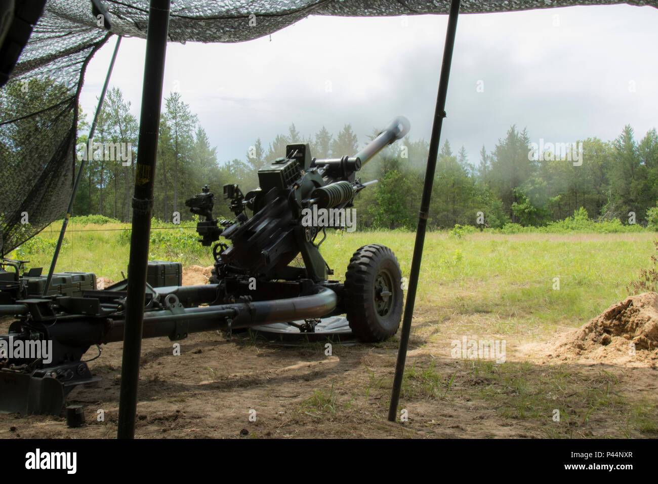 The Battery B, Gun 4, test fires an M119A3 a 105 mm howitzer 105 mm, 35 ...