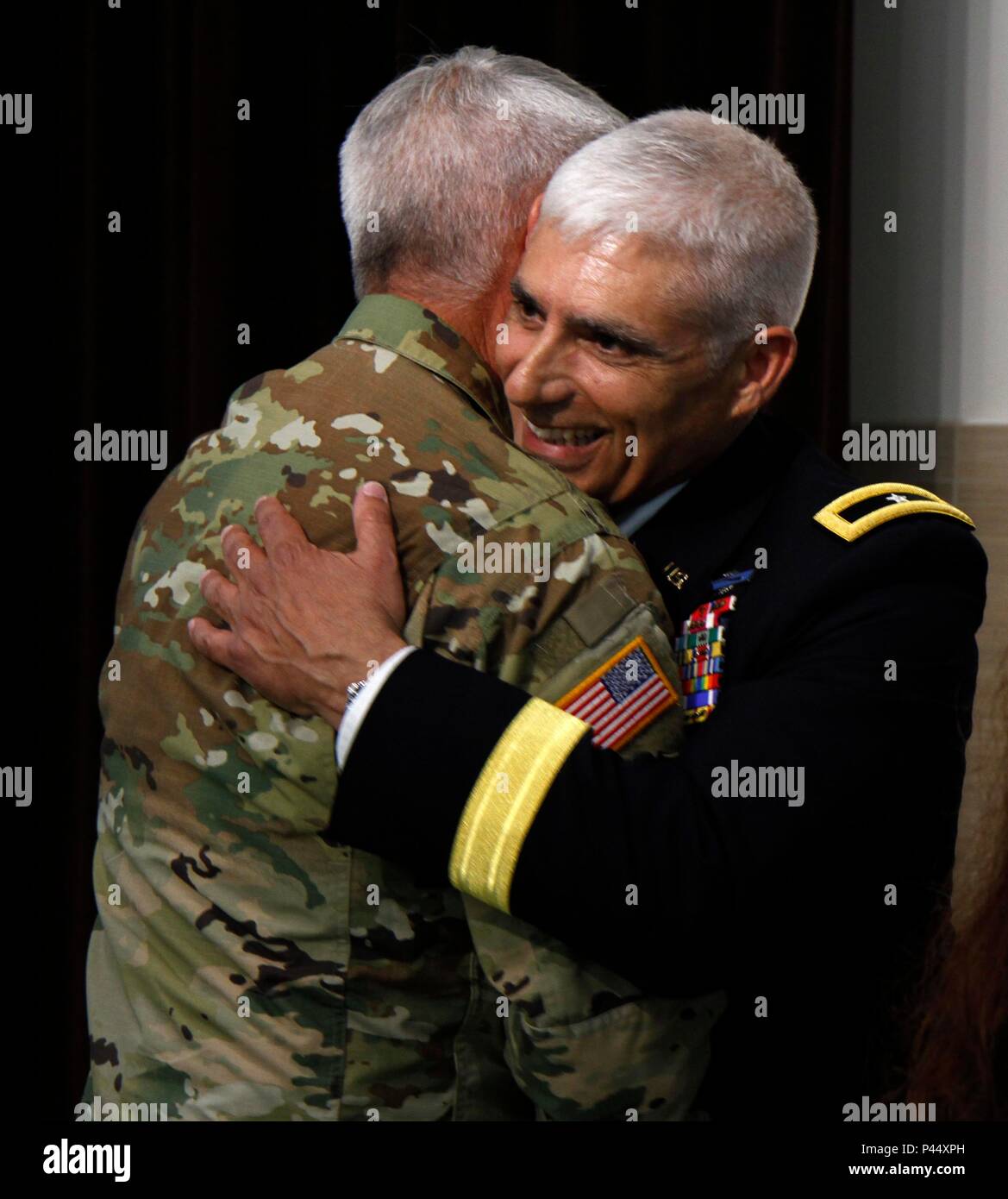 Brig. Gen. Ralph Ribas prepares to unfurl his command flag during his ...