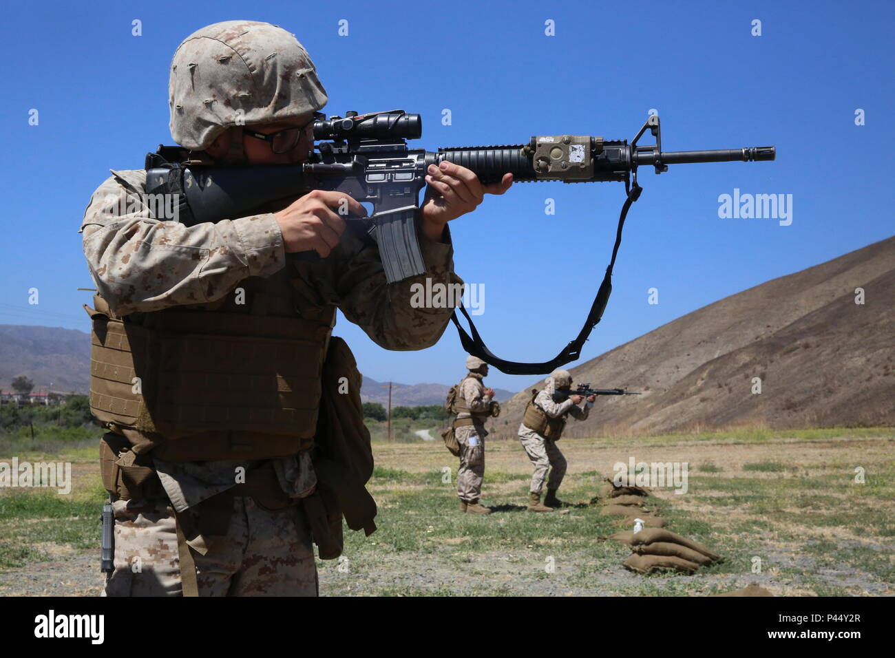 Private First Class Dylan Leonard aims at a target during the unknown ...